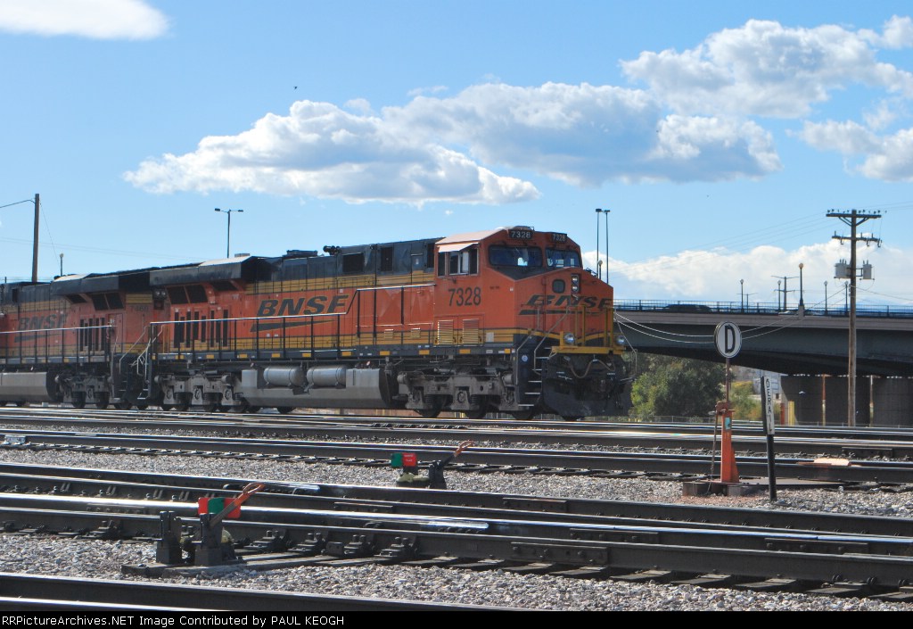 BNSF 7328 rolls into the BNSF Denver, Yard with a manifest train.